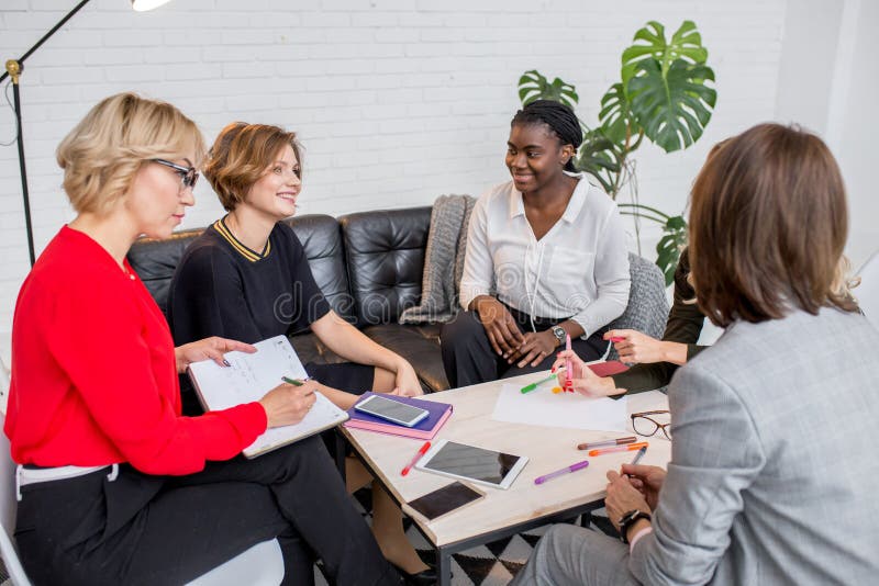 Group of Multiethnic Female Team Working in Office Stock Photo - Image ...