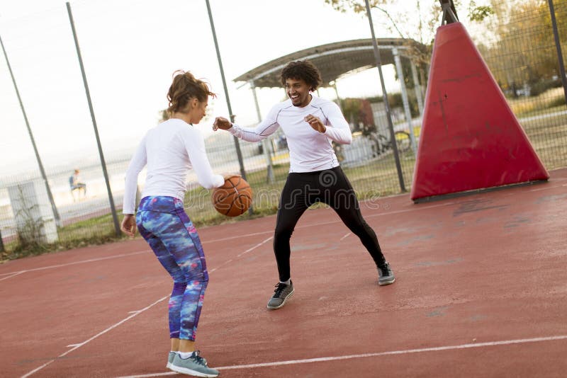 Group of Multiethnic People Playing Basketball on Court Stock Photo ...
