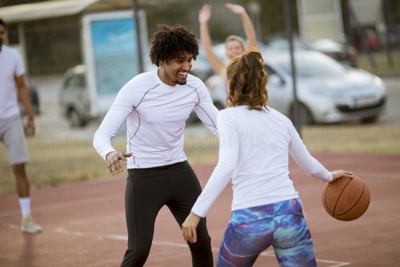 Group of Multiethnic People Playing Basketball on Court Stock Image ...