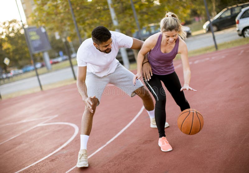Group of Multiethnic People Playing Basketball on Court Stock Image ...