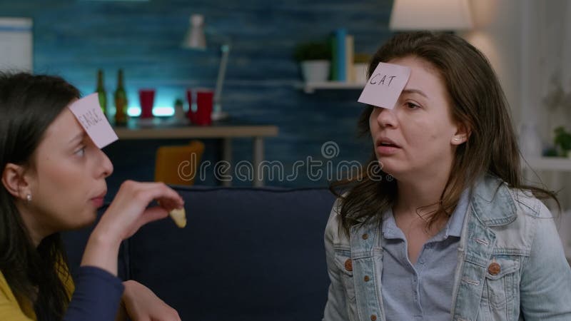 Group of Multiethnic People Playing Interesting Guess Who Game Putting ...