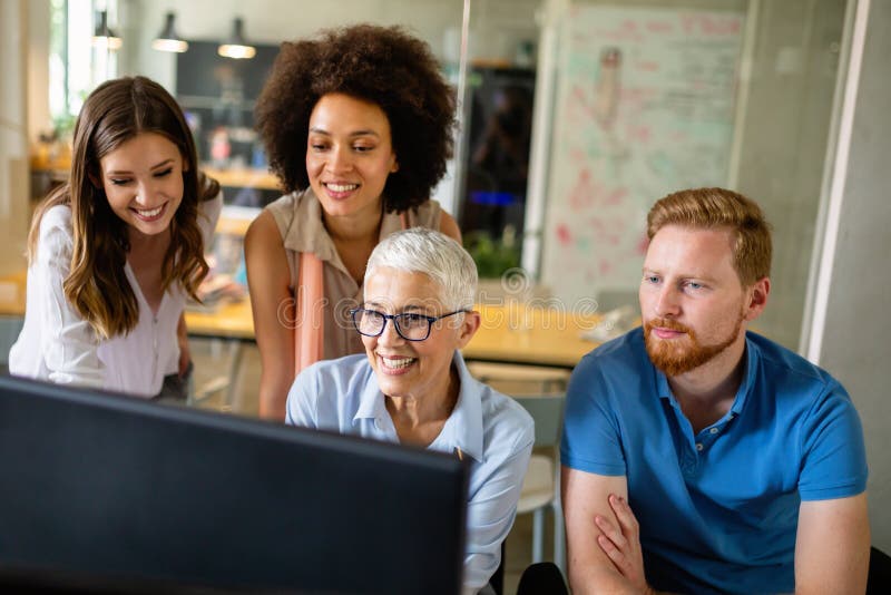 Group of Programmer Working in a Software Developing Company Office ...
