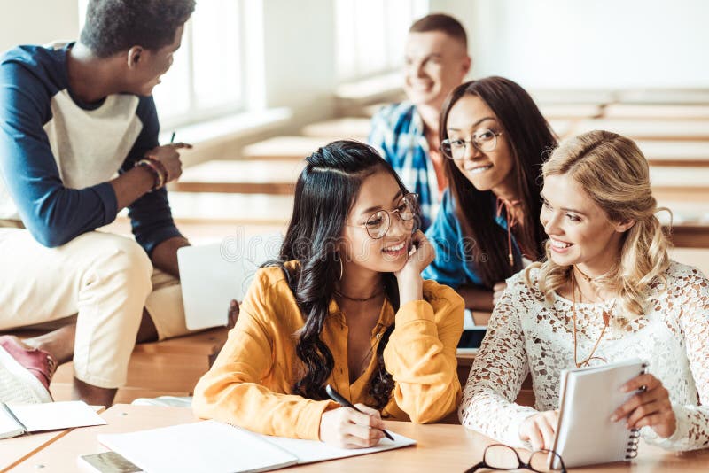 Group of Multiethnic Students Discussing Homework Stock Image - Image ... Group of Multiethnic Students Discussing Homework Stock Image - Image ...