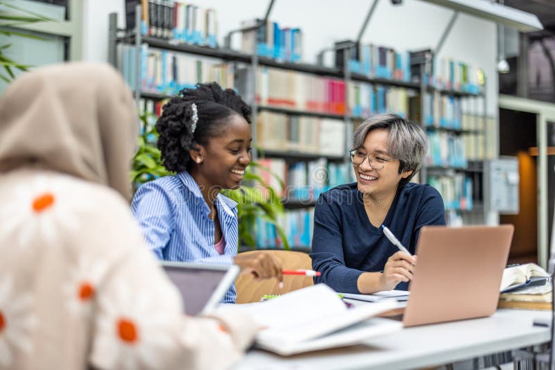 Group of Multiethnic Students in a Library Stock Photo - Image of ...