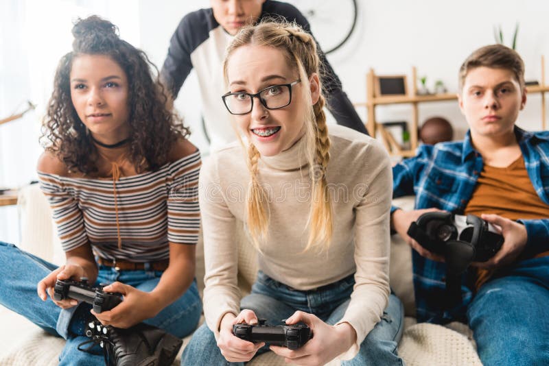 Group of Multiethnic Teens Playing Video Game Stock Photo - Image of ...
