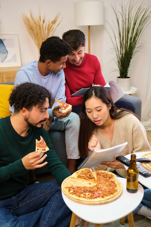 Group of Multiethnic University Colleagues Studying and Eating Pizza ...