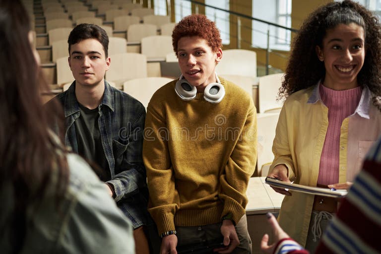 Diverse Group of University Students Engaging in Conversation in ...