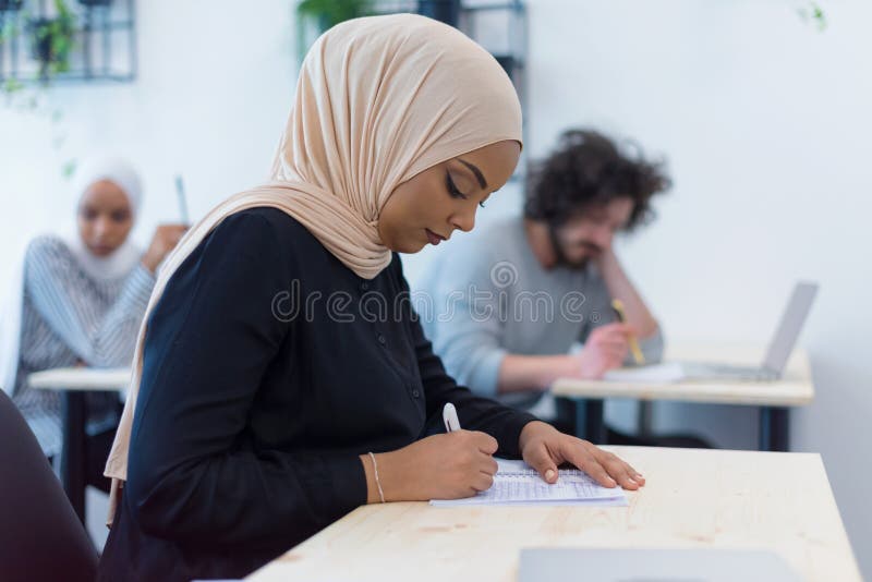 Group of Multiethnic University Students Working on Practice Lessons ...