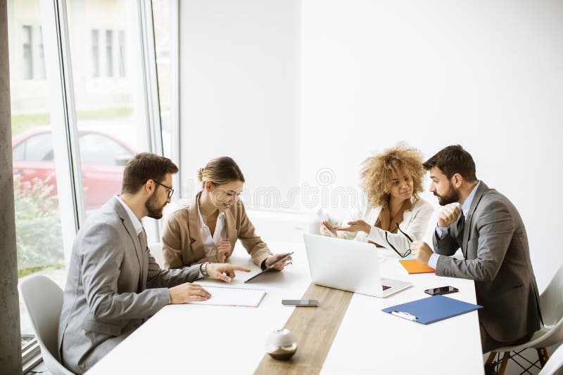 Multiethnic Young Business People Working Together in the Office Stock ...