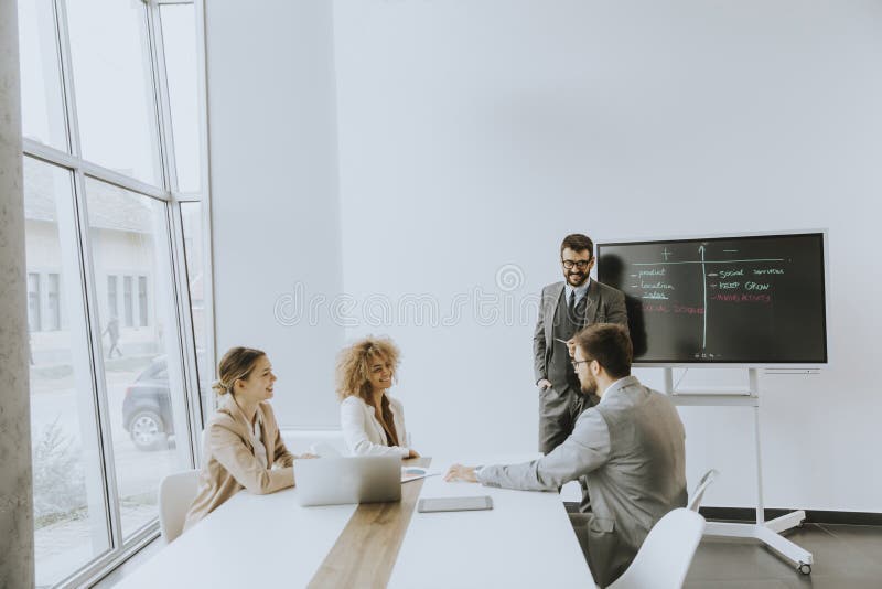 Multiethnic Young Business People Working Together in the Office Stock ...