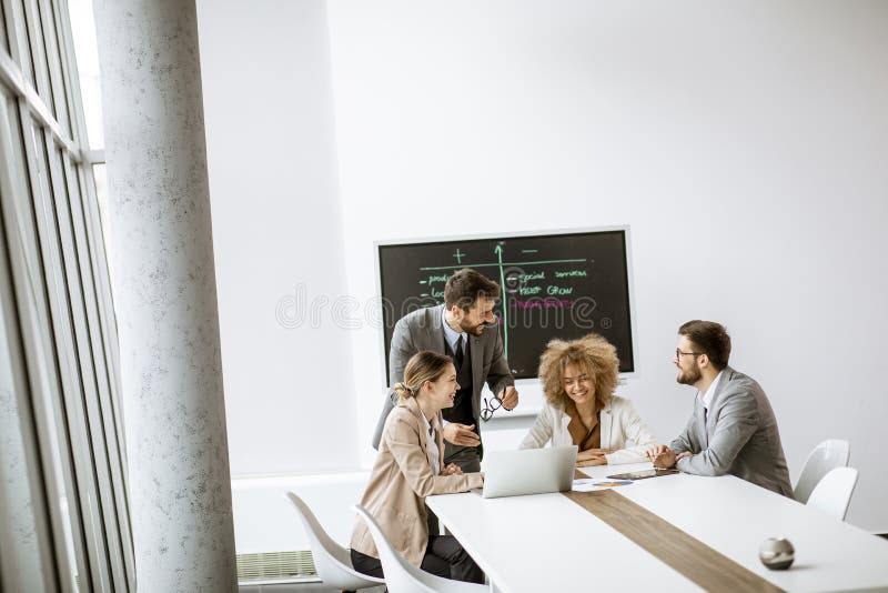 Multiethnic Young Business People Working Together in the Office Stock ...