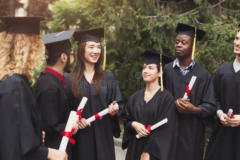 A Group of Graduates Celebrating Stock Photo - Image of ceremonious ...