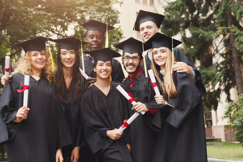 Graduates Having a Group Hug Stock Photo - Image of bright, ceremony ...