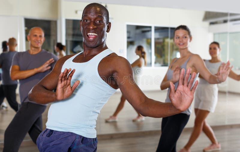 Group of Multinational Happy People Practicing Dance Movement Stock ...