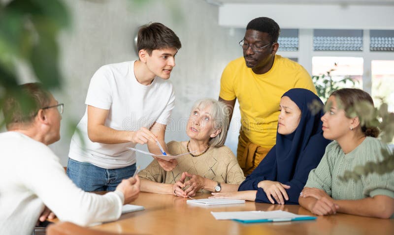 Group of Multinational People Making Notes at Table Stock Image - Image ... Group of Multinational People Making Notes at Table Stock Image - Image ...