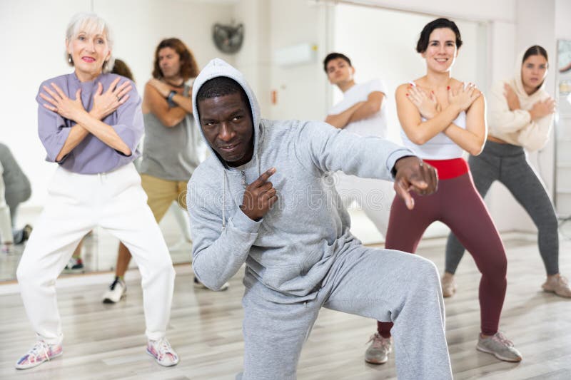 Group of Multinational People Practicing New Modern Dance Techniques ... Group of Multinational People Practicing New Modern Dance Techniques ...