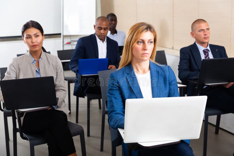 Group of Multinational People Working on Laptops during Business ... Group of Multinational People Working on Laptops during Business ...