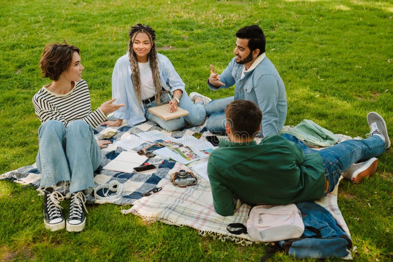 Group of Multinational Students Friends Studying Together while Sitting ...