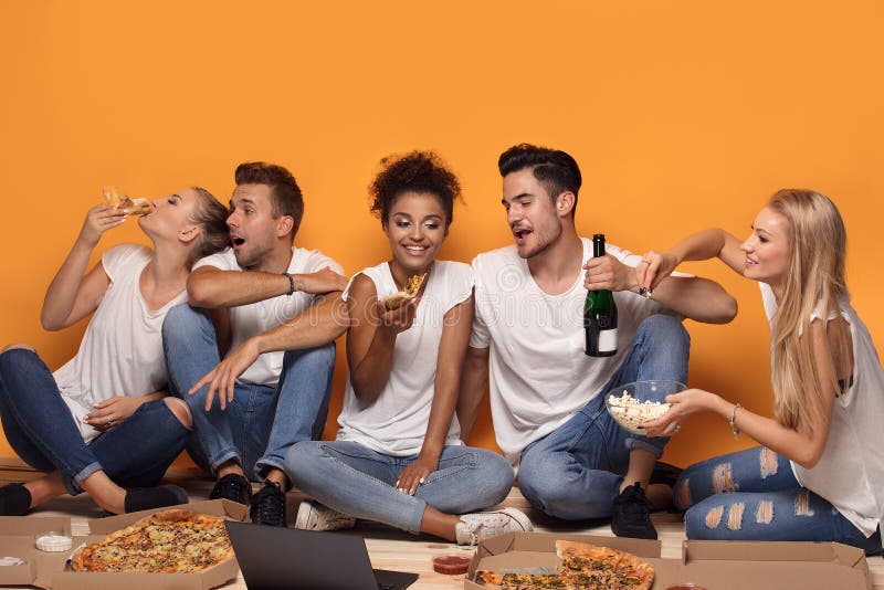 Multiracial People Having Fun, Eating Pizza. Stock Photo - Image of ...