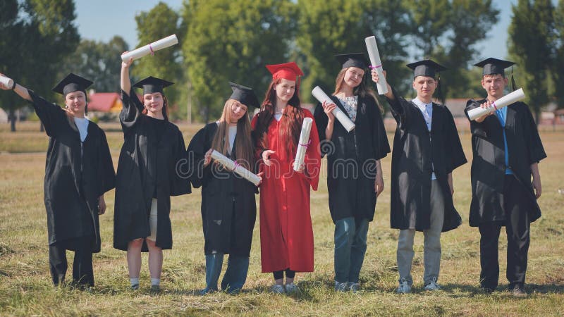 Group of Multiracial Graduates Holding Diploma. Stock Image - Image of ...