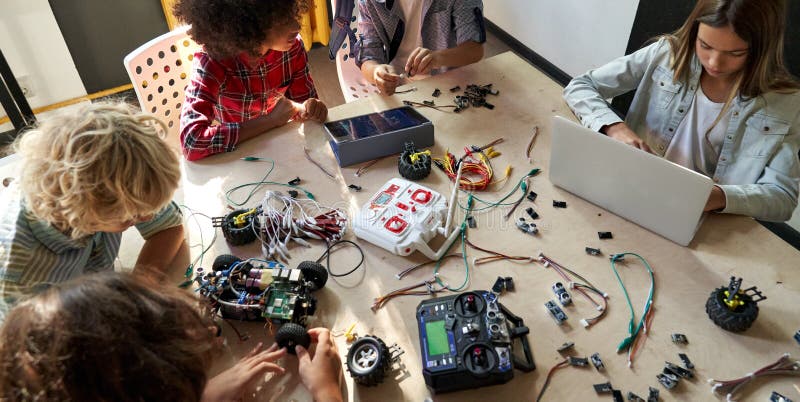 Group of Multiracial Schoolkids at Stem Class Building Robot. Table Top View. Stock Photo ...