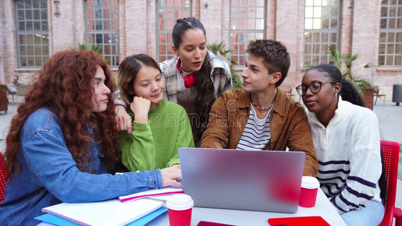 Group of Multiracial Students Doing the High School Homework Using a ...