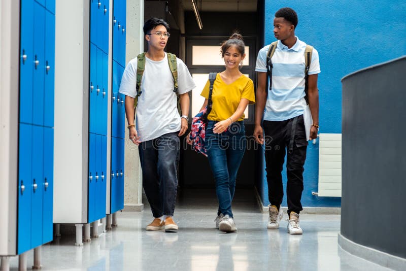 Group of Multiracial Teen High School Students Changing Classes Walking ...