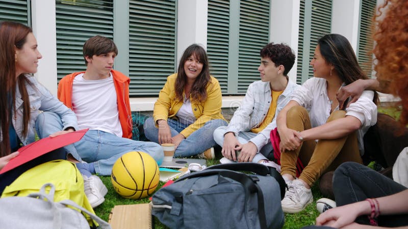 Group of Multiracial University Students Sitting Together at College ... Group of Multiracial University Students Sitting Together at College ...