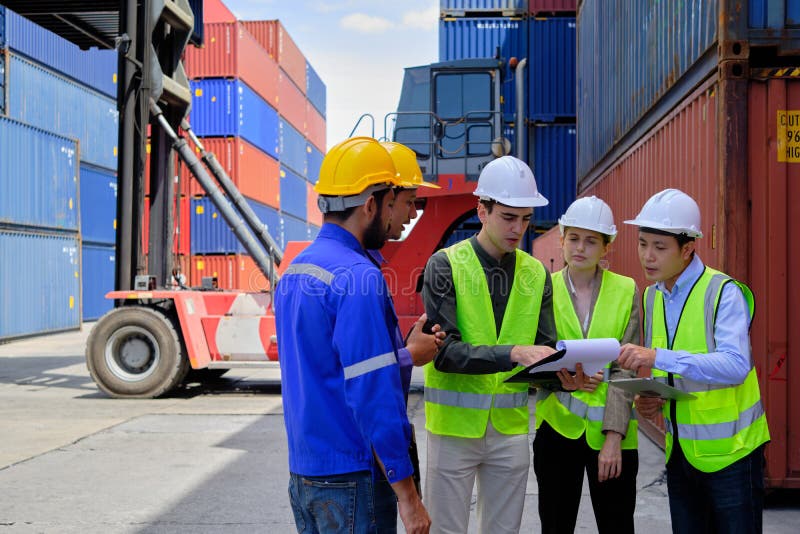 Group of Workers Teamwork at Logistics Terminal with Many Stacks of ...