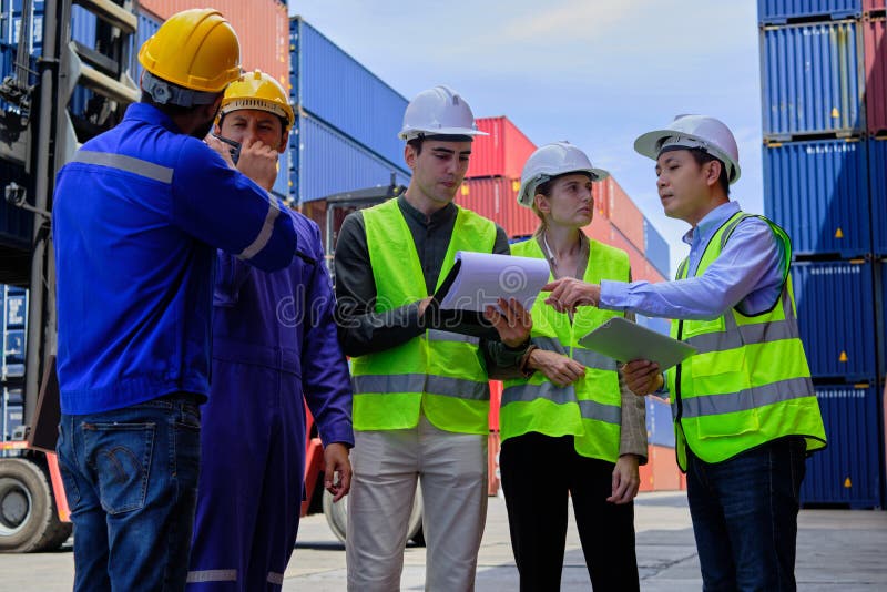 Group of Workers Teamwork at Logistics Terminal with Many Stacks of ...