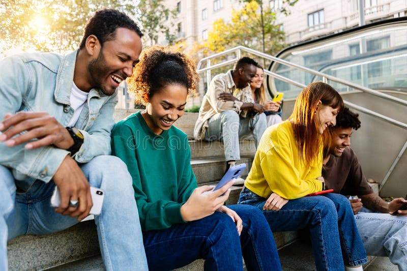 Group of Multiracial Young People Using Mobile Phone Devices Sitting ... Group of Multiracial Young People Using Mobile Phone Devices Sitting ...