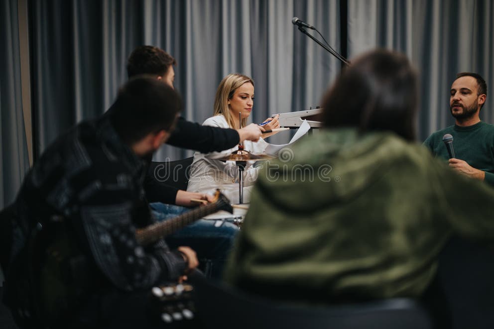 Musicians Collaborating during a Rehearsal Session in a Creative Studio ...
