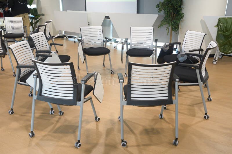 A Group of Office Chairs Arranged in a Pattern of a Circle Stock Photo ...