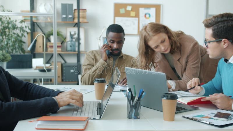 Group of Office Workers Busy with Routine Activities Using Laptops ...
