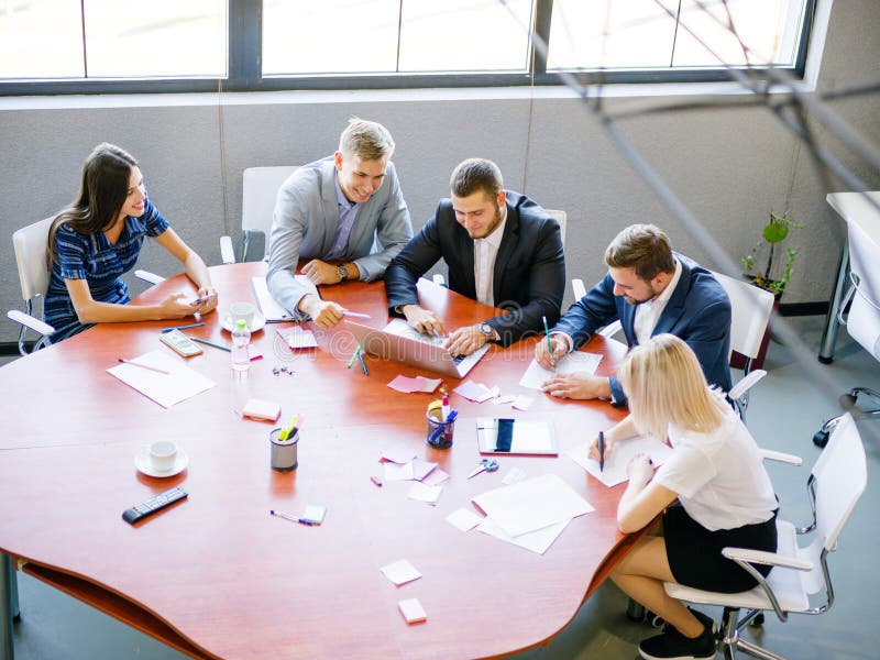 A Group of Office Workers Work at the Desk in the Office Stock Photo ...