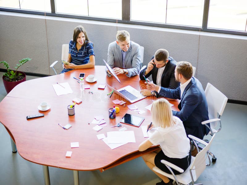 A Group of Office Workers Work at the Desk in the Office Stock Photo ...