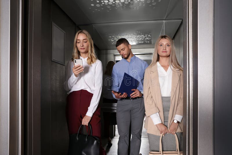 Group of Office Workers in Modern Elevator Stock Photo - Image of group, hotel: 258978214
