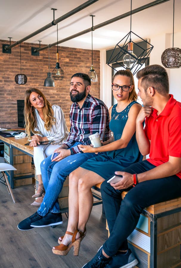 Office Workers Team Talking Sitting Over the Table in Coworking Stock ...