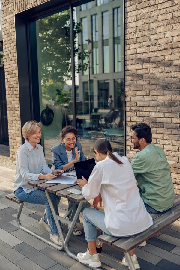 Group of Office Workers Working on the Terrace of the Office. Teamwork ...