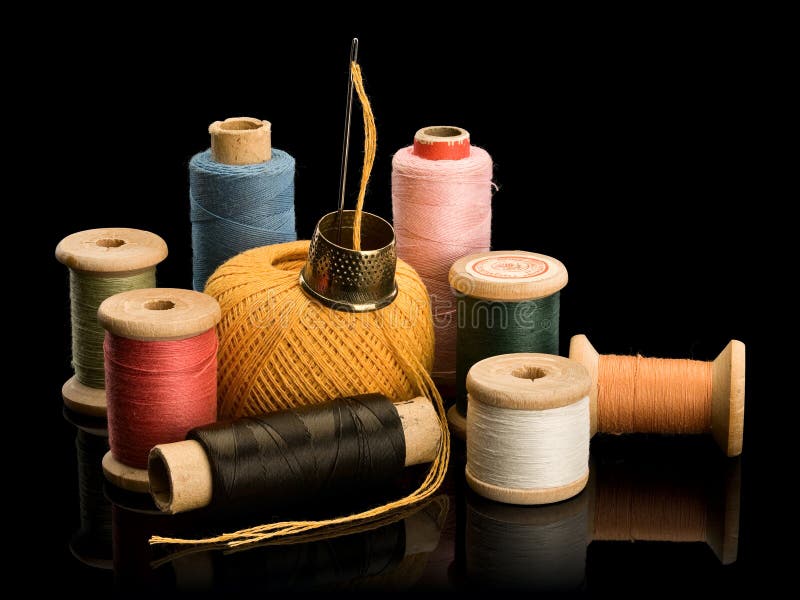 Group of Old Coils with Multi-colored Threads and Needle with Thimble ...