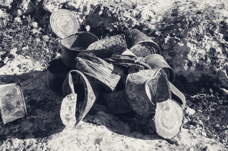 Group of Old Rusty Tin Cans Covered with Ash on Stones at Sunny Day ...