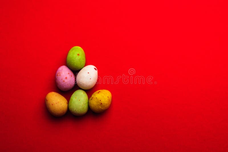 A Group of Painted Easter Eggs on a Red Background. Stock Image - Image ...