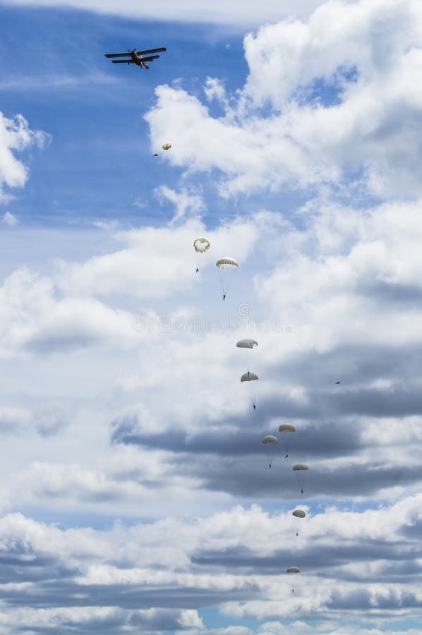 A Group of Paratroopers Jumping from the Plane One after Another Stock ...