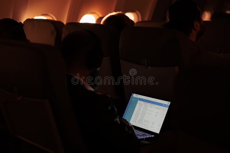 Group of Passengers Being Seated on Commercial Flight during Sunset ...