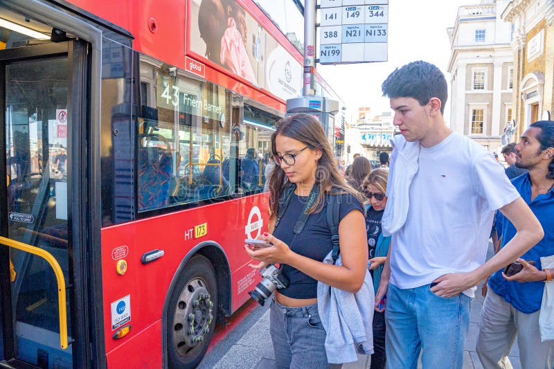 Group of Passengers Getting on a Double-decker Bus,London. Editorial ...