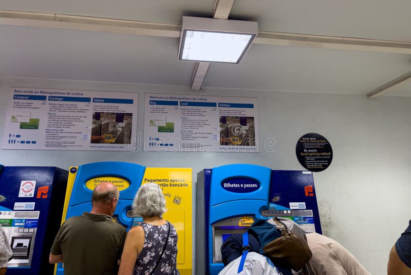 Group of Passengers Waiting in Front of Vending Machines To Get Their ...