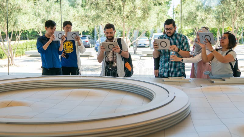Group of People in Apple Store Looking at Infinite Loop Apple ...