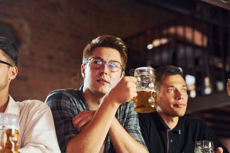 Group of People in Casual Clothes Sitting in the Pub Stock Image ...