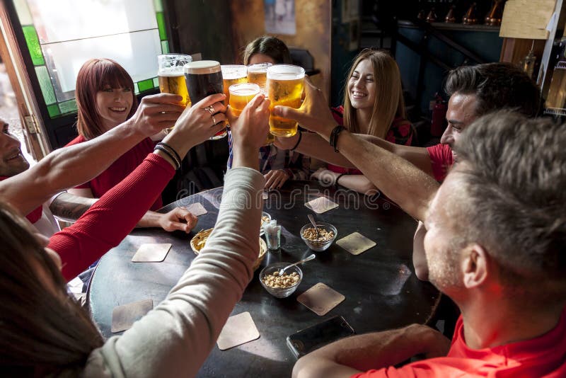 Group of People Celebrating in a Pub Stock Image - Image of craft ...