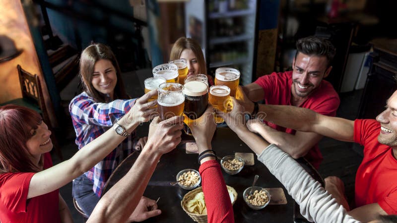 Group of People Celebrating in a Pub Stock Image - Image of lager ...